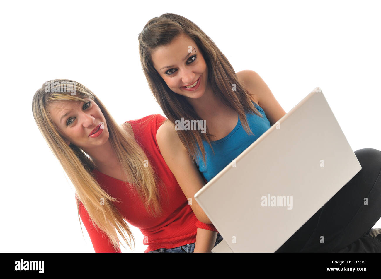 two young girls work on laptop isolated Stock Photo - Alamy