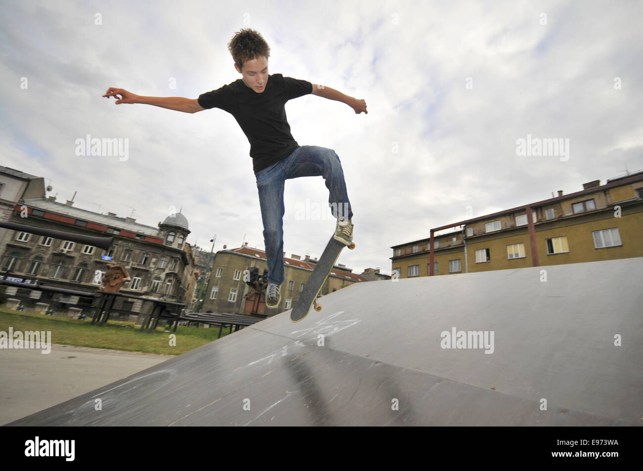 Boy practicing skate in a skate park Stock Photo - Alamy