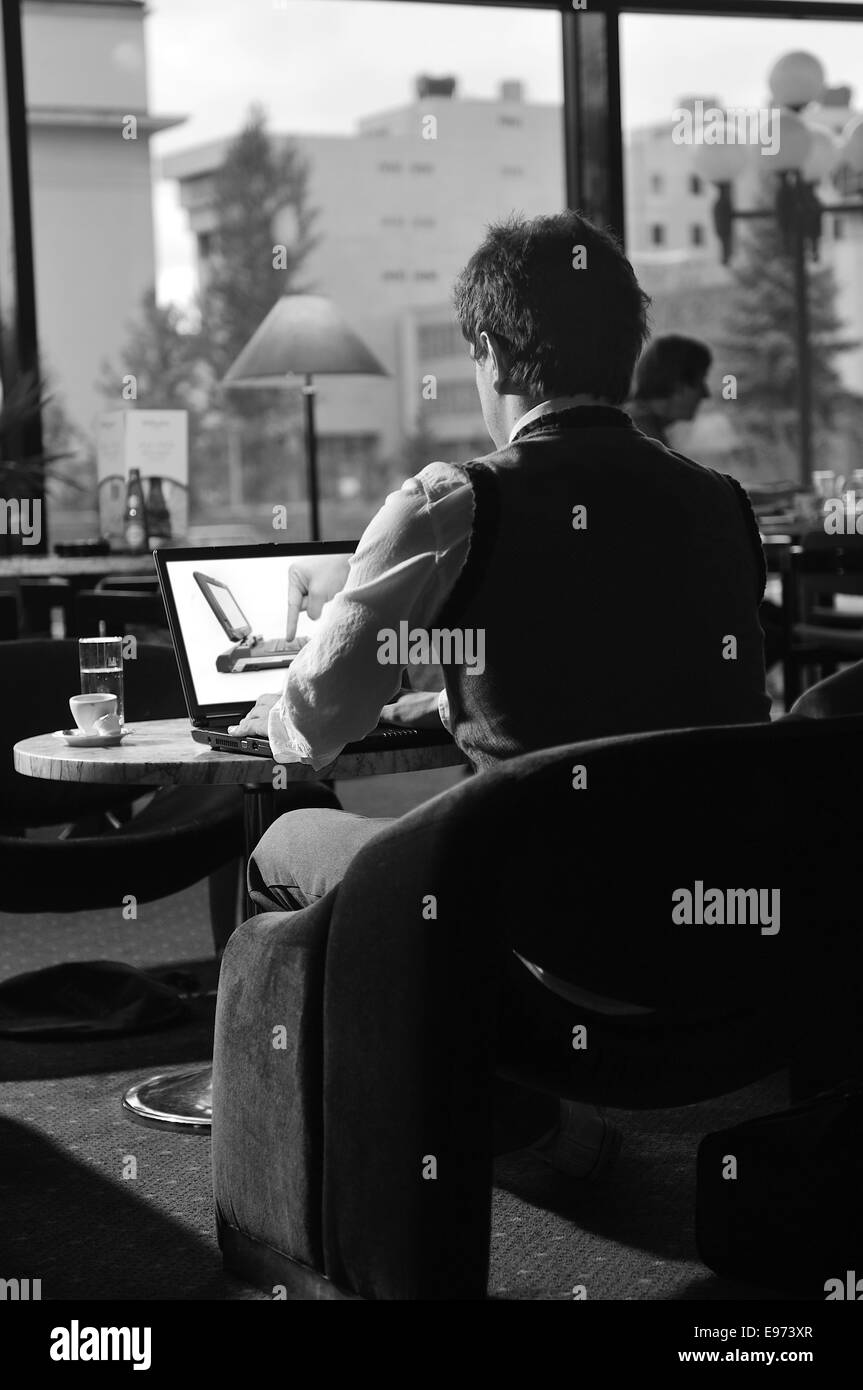 Working on laptop computer home Black and White Stock Photos & Images ...