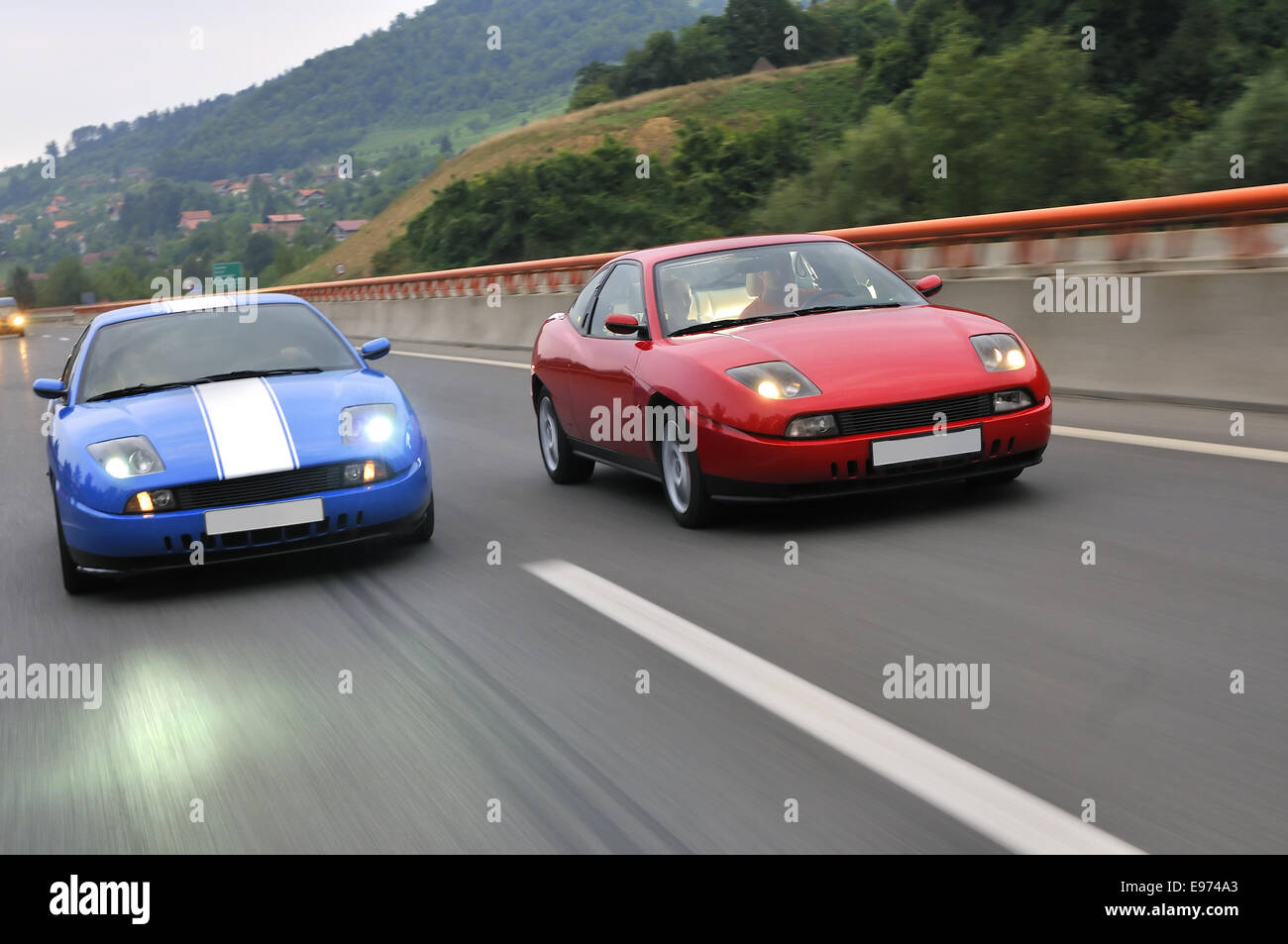 Tuning cars sacing down the highway Stock Photo - Alamy