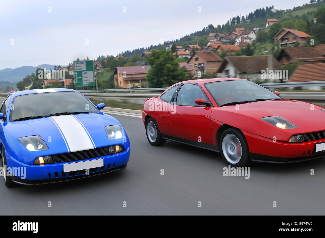 Blue sports car with white stripe hi-res stock photography and images ...