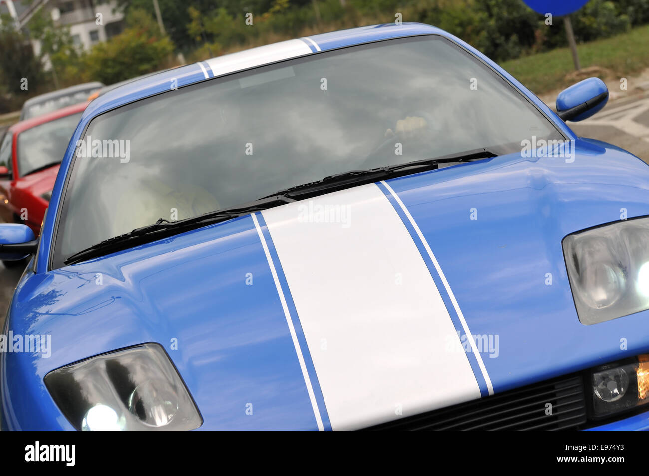 Blue sports car with white stripe hi-res stock photography and images ...