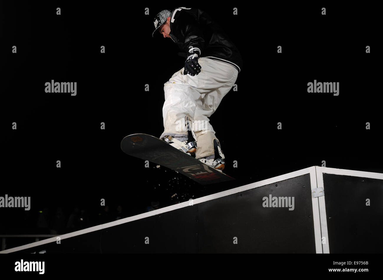 freestyle snowboarder jump in air at night Stock Photo - Alamy