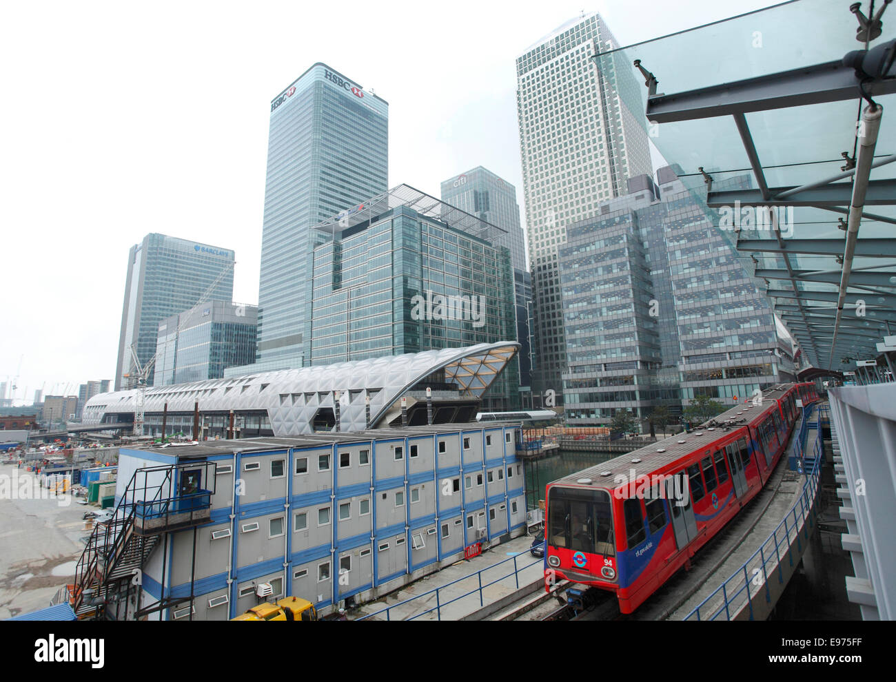 UK, London, Canary Wharf, Docklands Light railway trains passing the ...