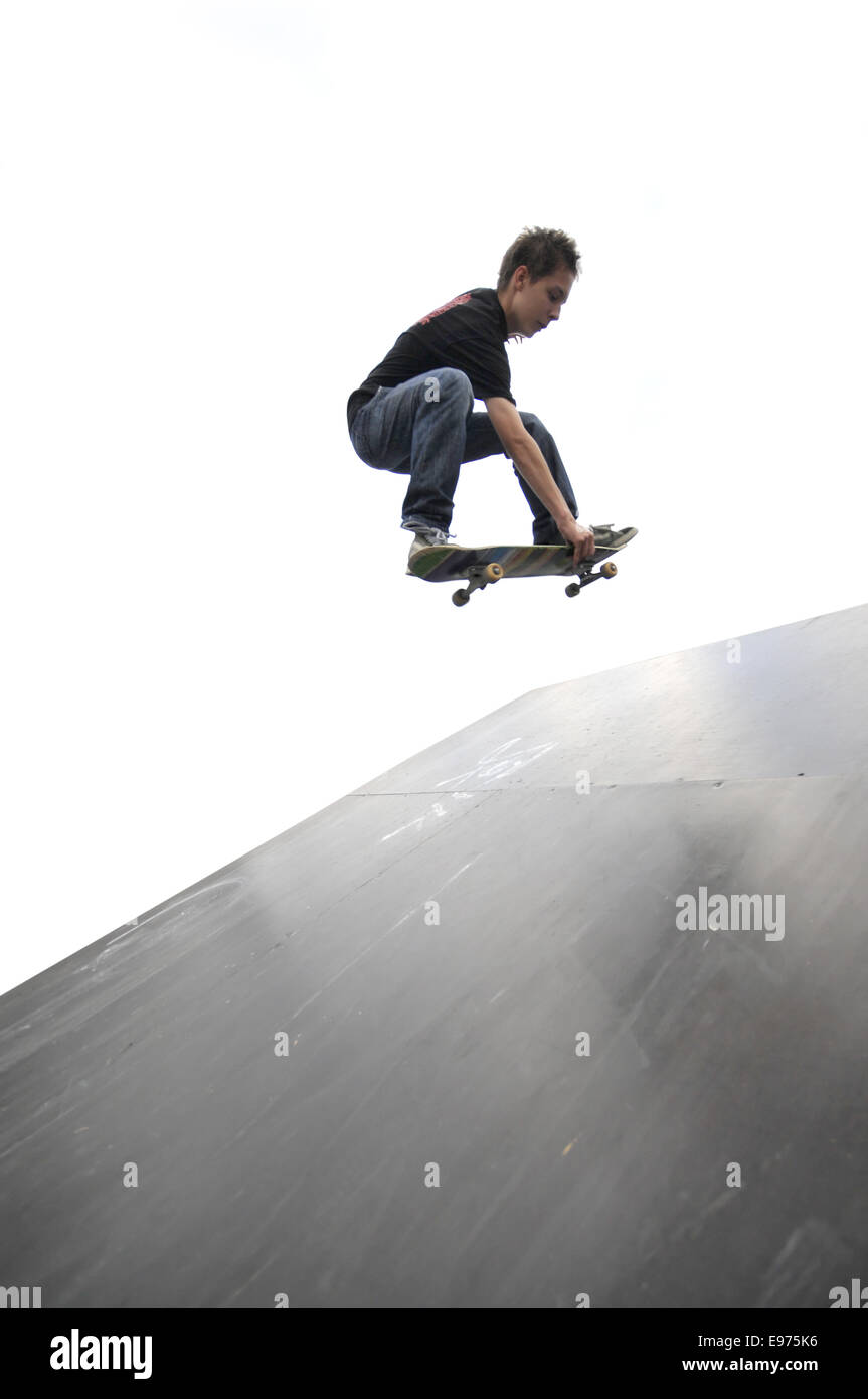 Boy practicing skate in a skate park Stock Photo - Alamy