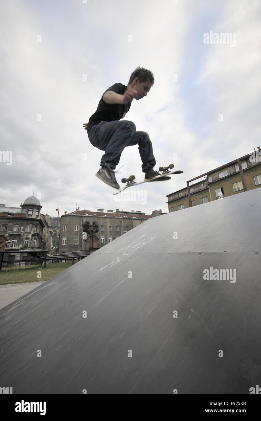 Boy practicing skate in a skate park Stock Photo - Alamy