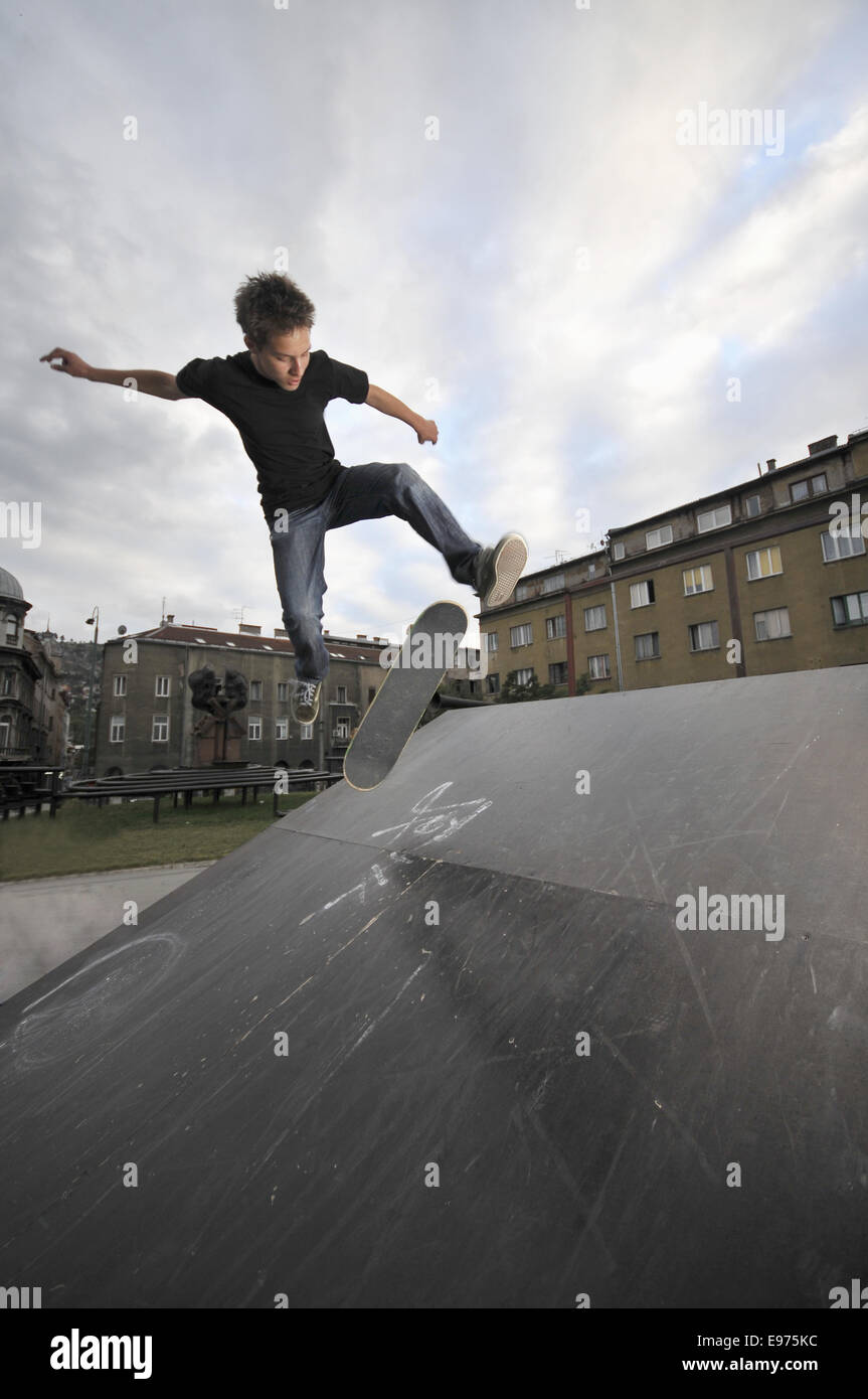 Boy practicing skate in a skate park Stock Photo - Alamy
