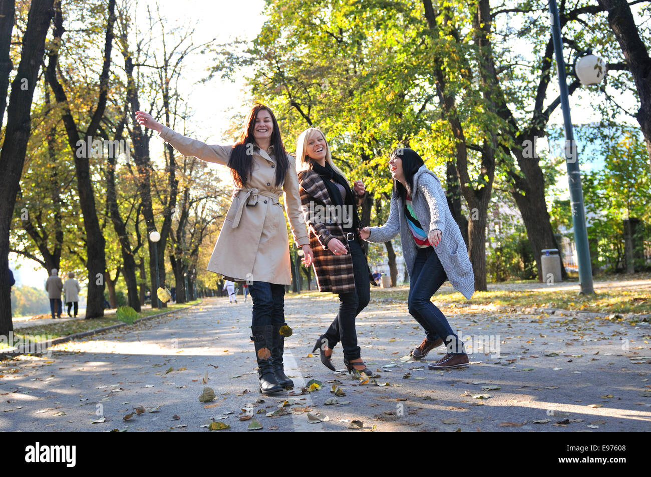 Happy three friends outdoors Stock Photo - Alamy