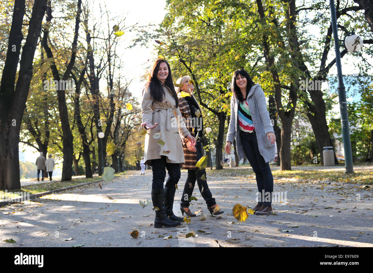 Happy three friends outdoors Stock Photo - Alamy