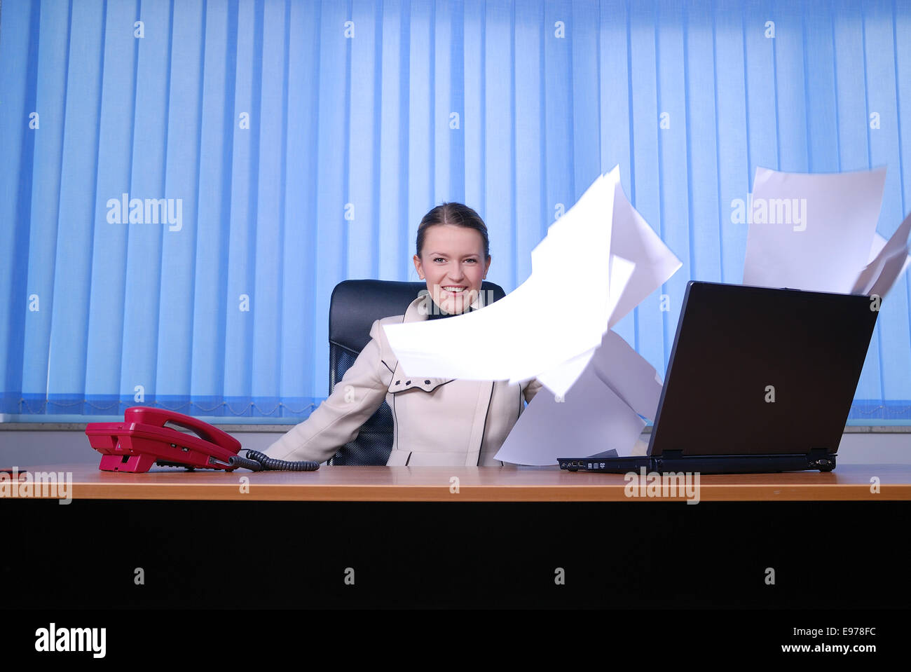 Woman papers throw laptop hi-res stock photography and images - Alamy