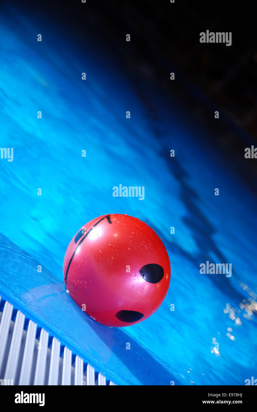 .red ball in swimming pool Stock Photo - Alamy