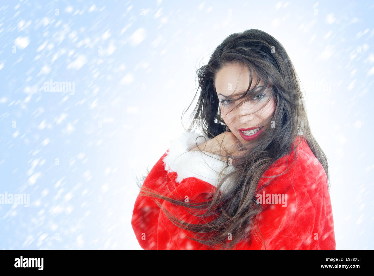 Happy female Santa in snowstorm Stock Photo - Alamy