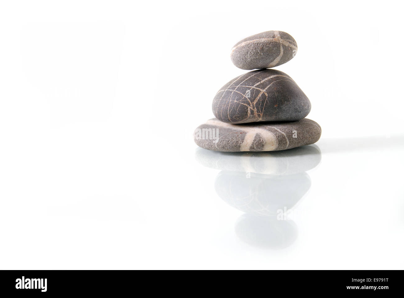 .zen stones with reflection isolated Stock Photo - Alamy