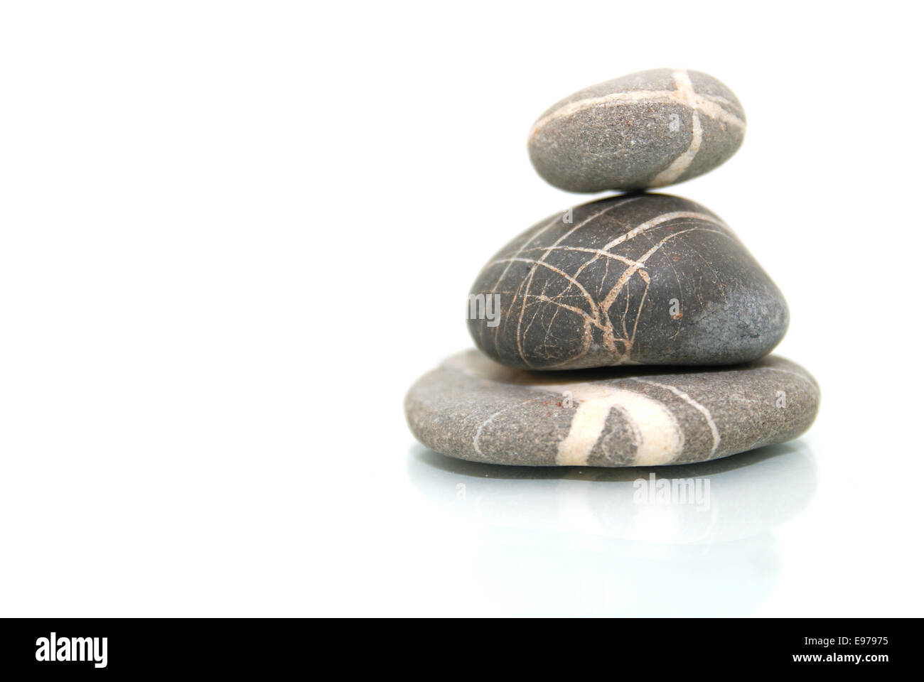 .zen stones with reflection isolated Stock Photo - Alamy