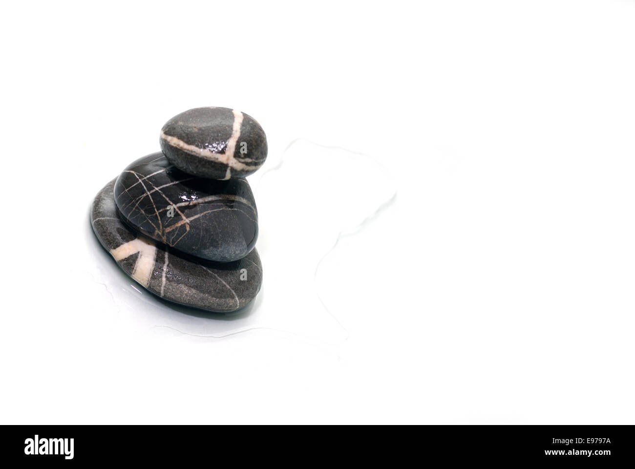 .zen stones with reflection isolated Stock Photo - Alamy