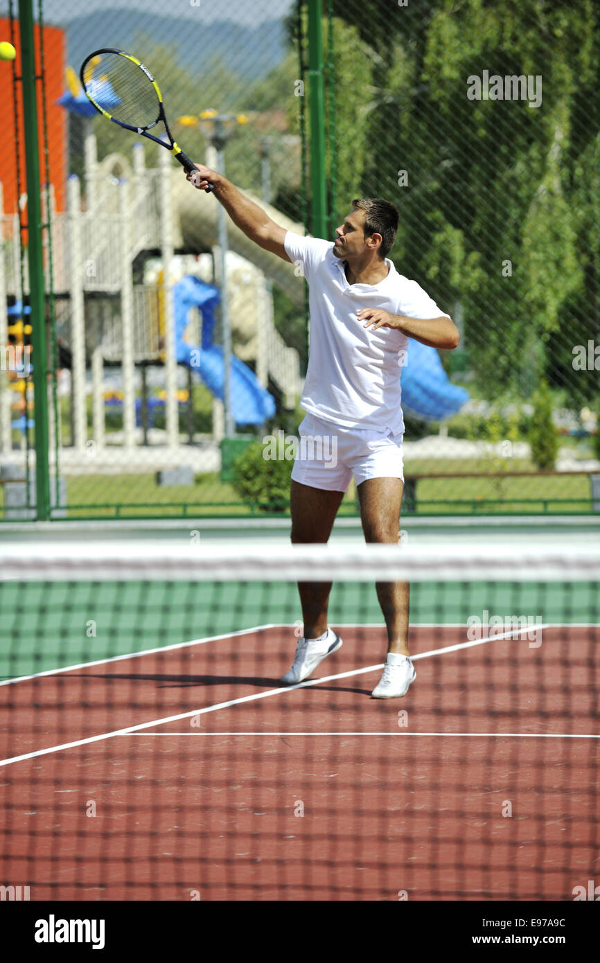 young man play tennis outdoor Stock Photo - Alamy
