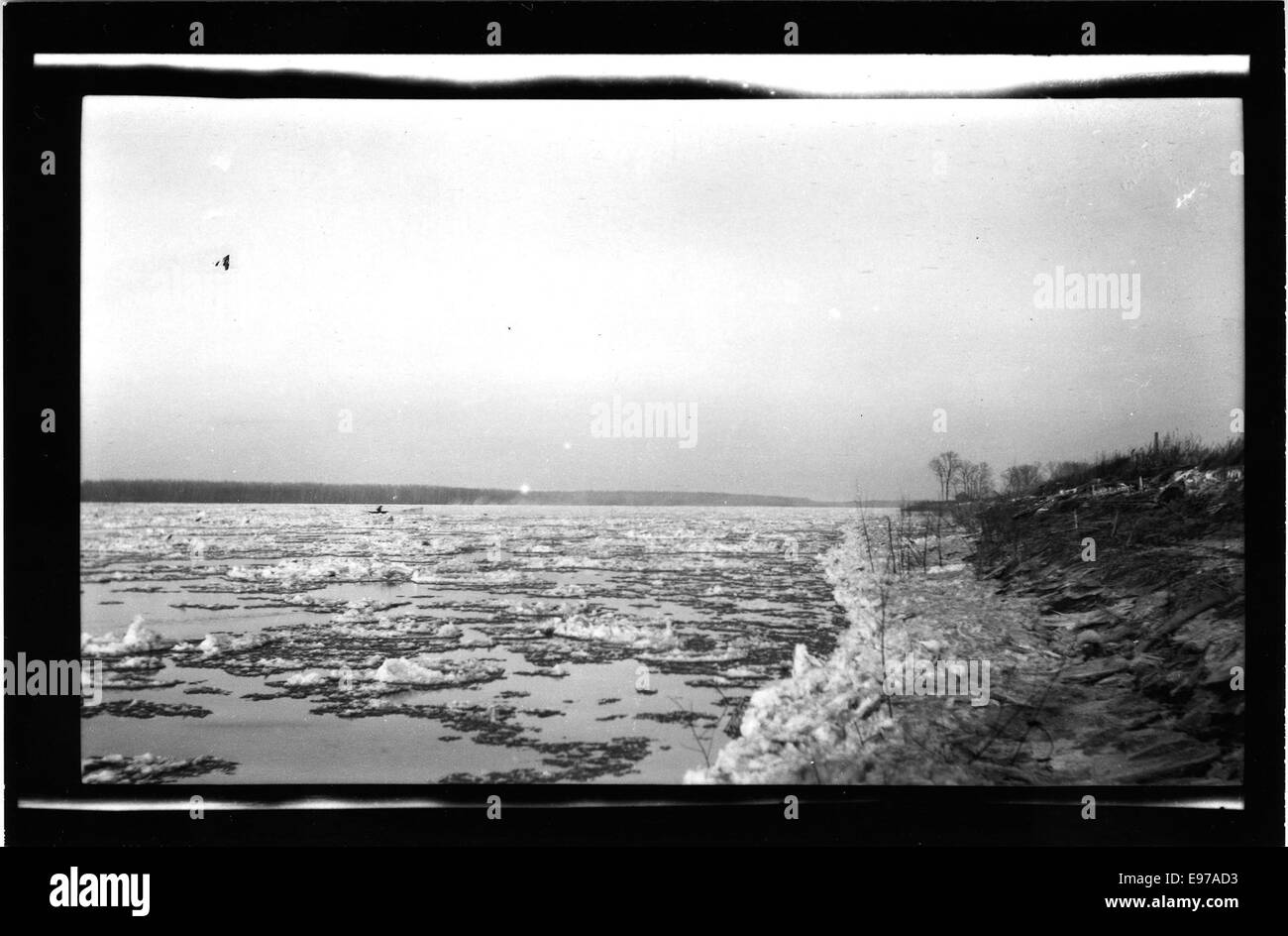 A historic photograph of the Mississippi River, frozen over with ice ...