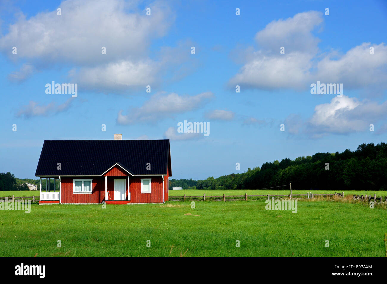The house and field Stock Photo - Alamy