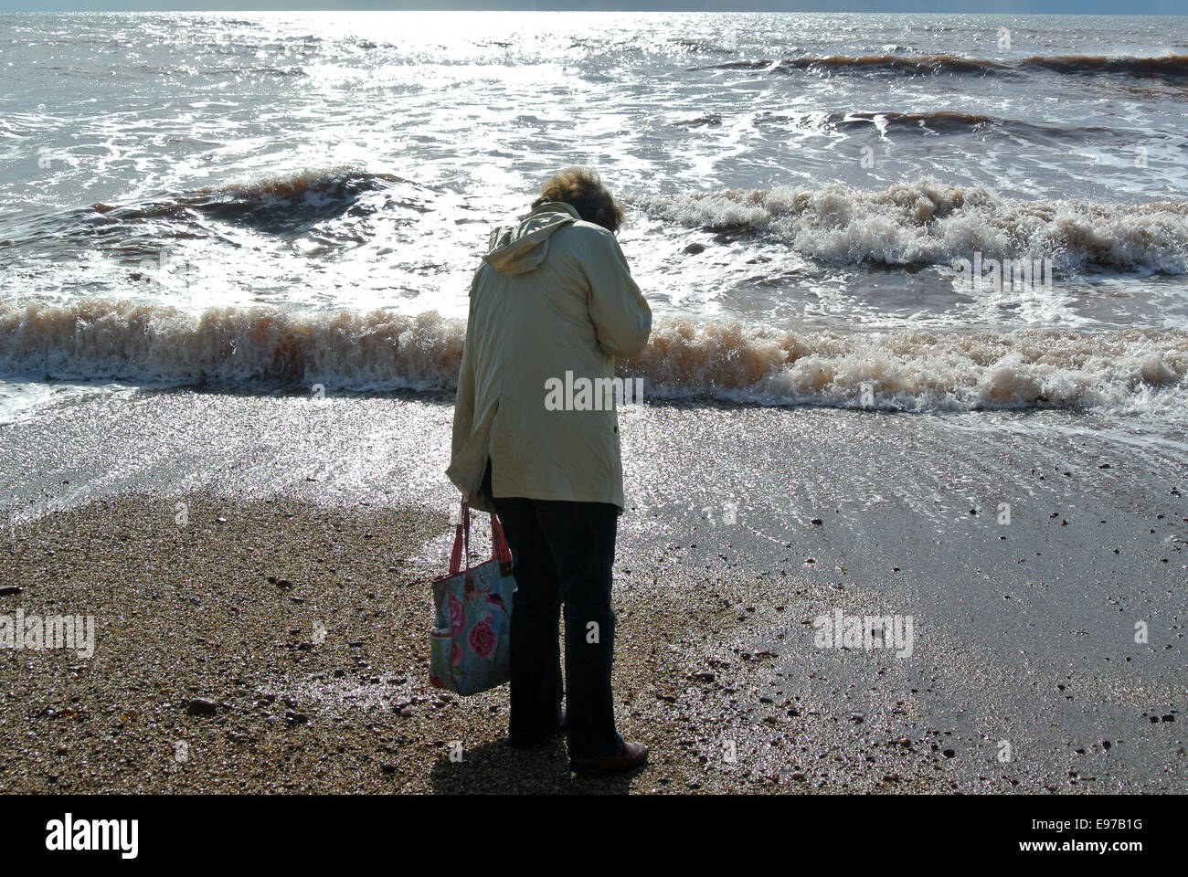 Depressed woman by the sea Stock Photo - Alamy