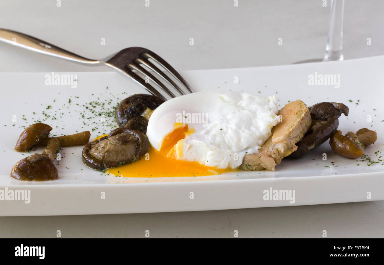Tapas, fried mushrooms with goose liver and poached egg Stock Photo - Alamy
