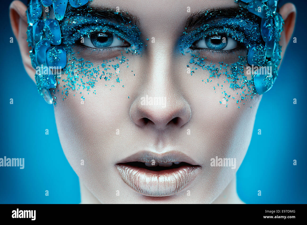 vivid portrait of a girl with an unusual blue make-up Stock Photo - Alamy