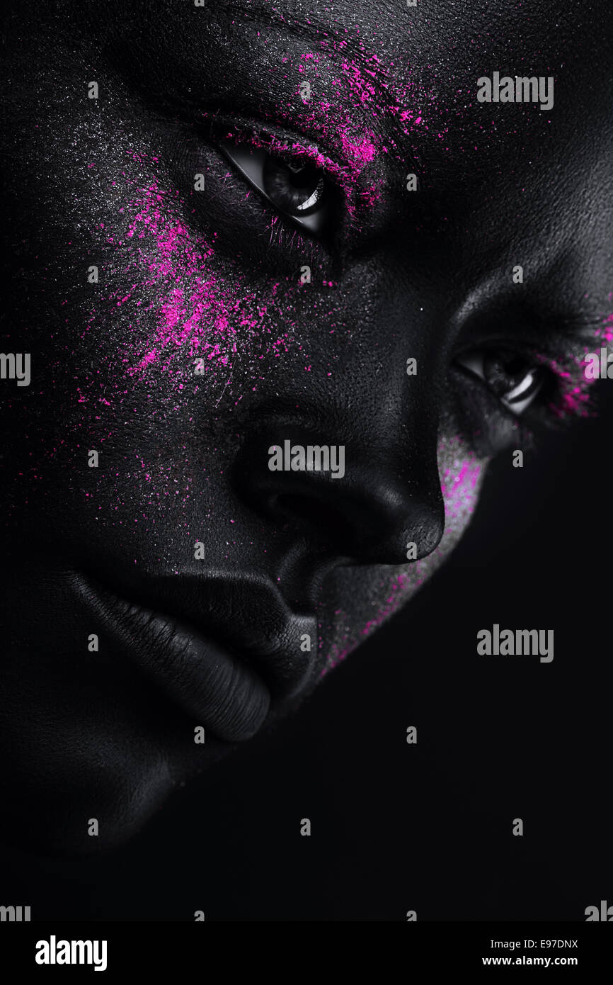 woman in black paint and neon pink powder Stock Photo - Alamy