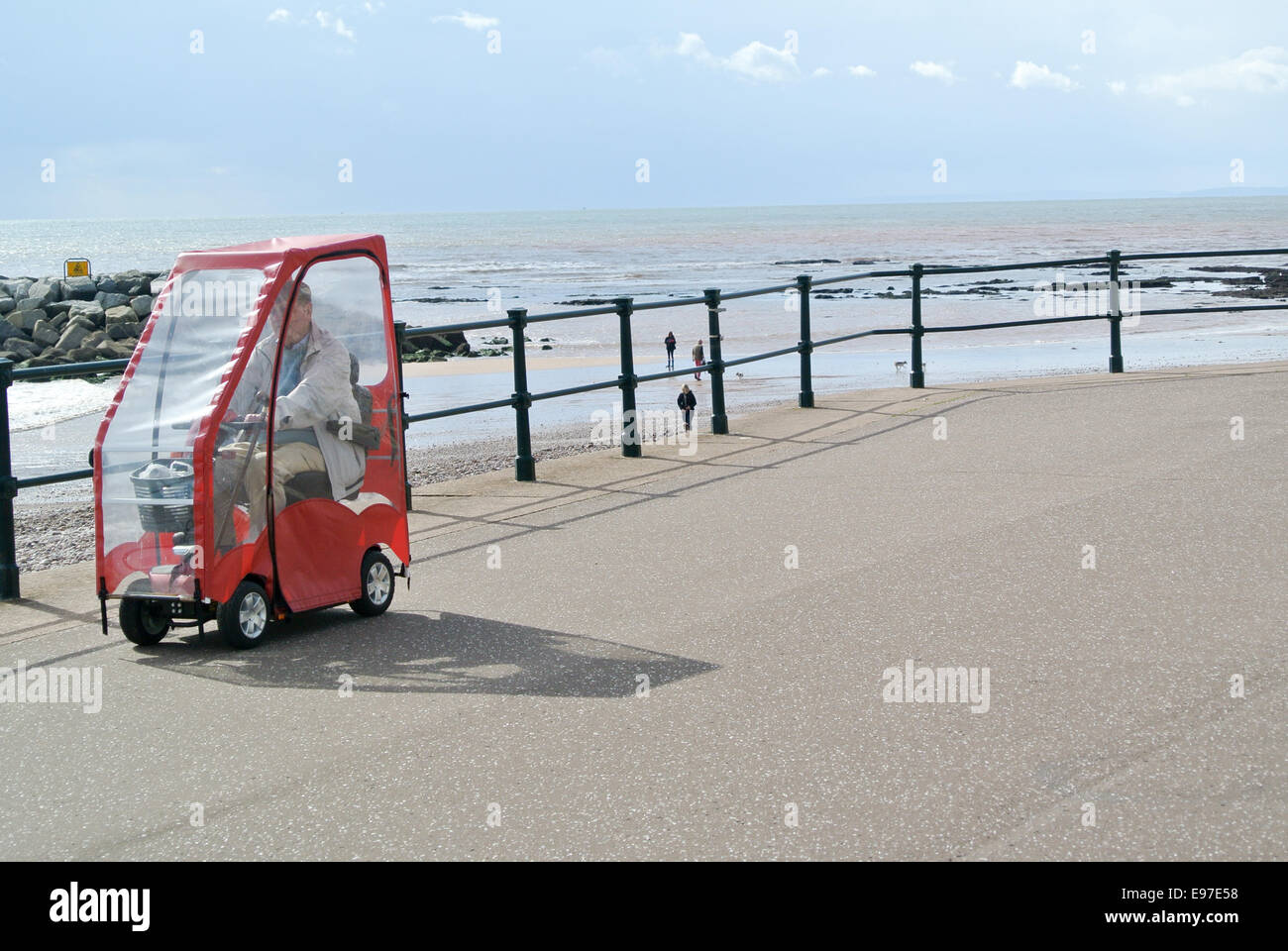 Red mobility vehicle by the sea Stock Photo - Alamy