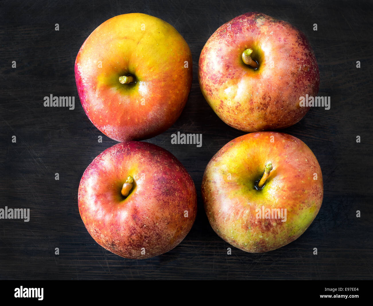 Four red apples, Belle de Boskoop on a dark background Stock Photo - Alamy