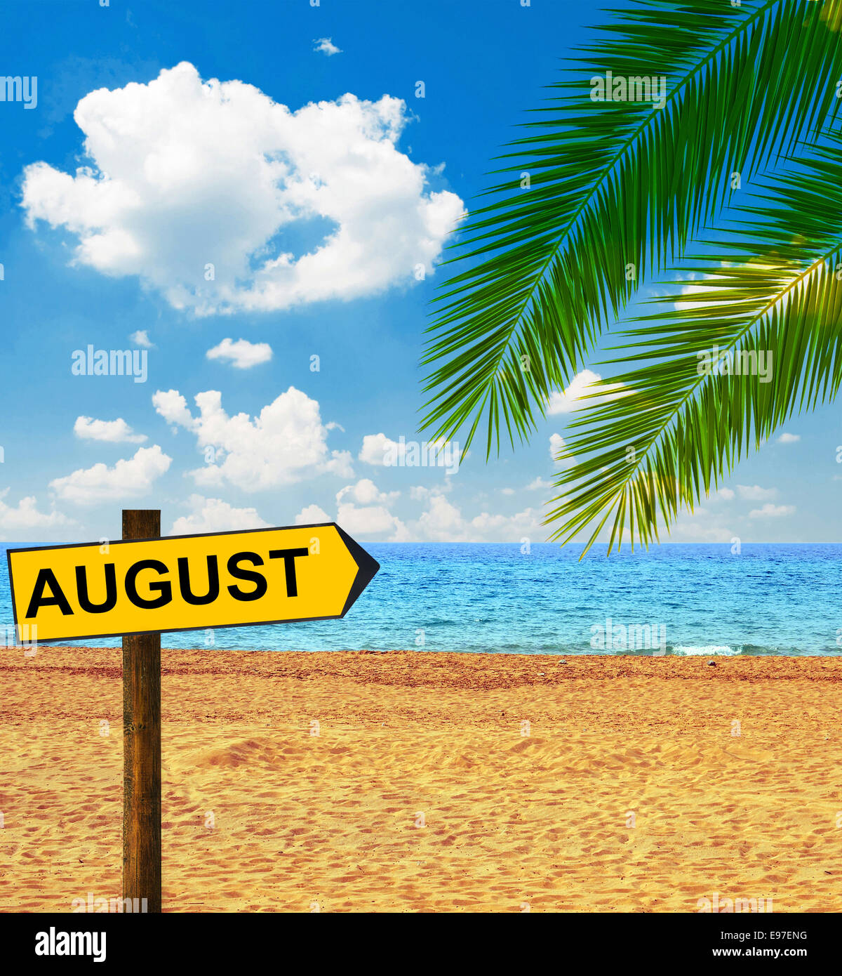 Tropical beach and direction board saying AUGUST Stock Photo - Alamy