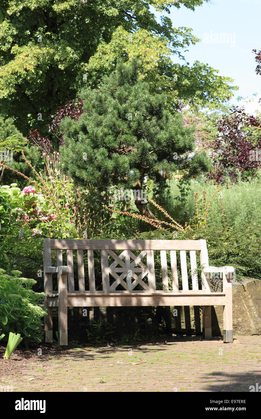 bench in a beautiful garden Stock Photo - Alamy