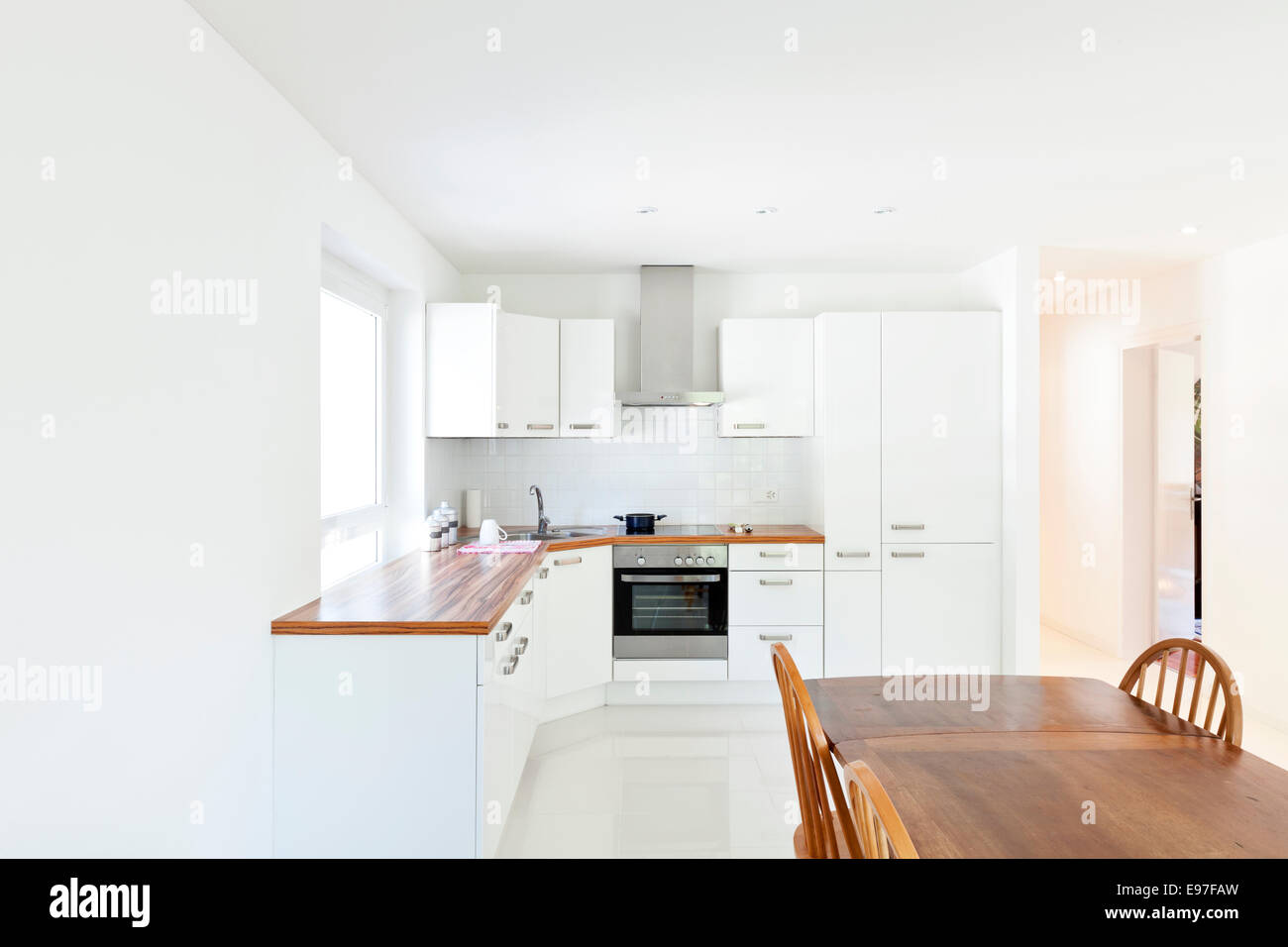 interior house, large modern kitchen, dining table Stock Photo - Alamy