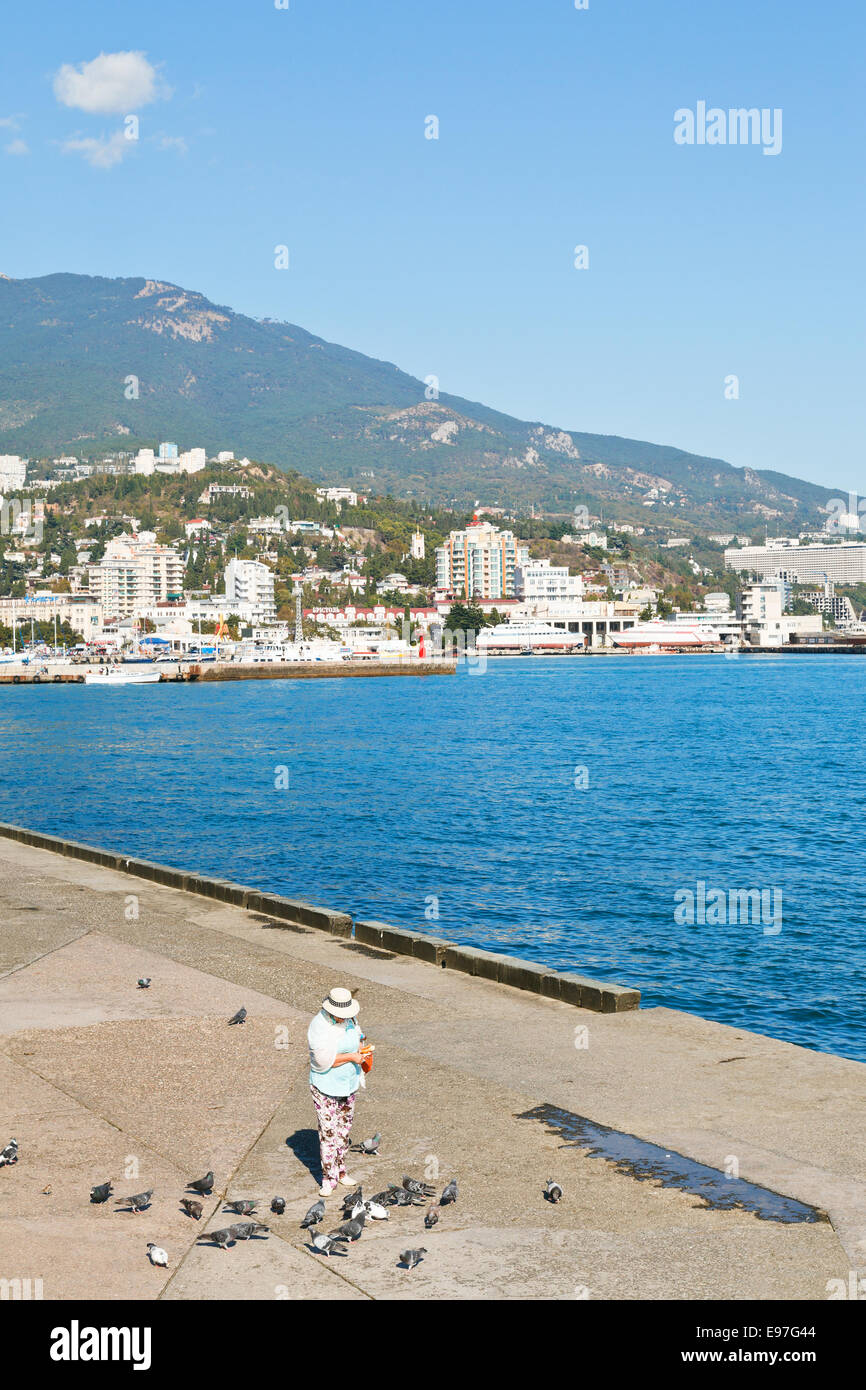 YALTA, RUSSIA - SEPTEMBER 30, 2014: people on waterfront of Yalta city ...