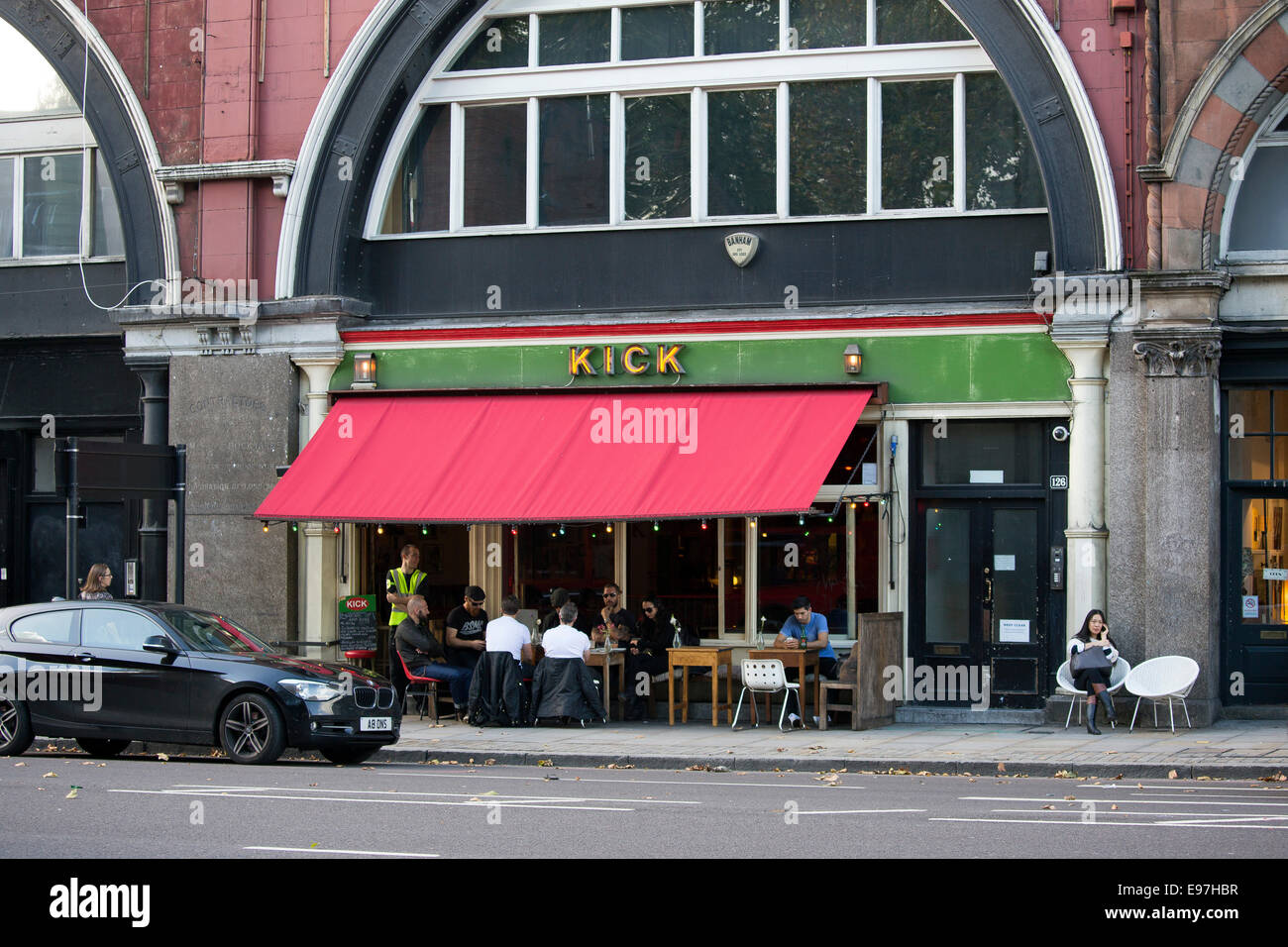 trendy cafe Kick people sitting outside hipster Stock Photo - Alamy