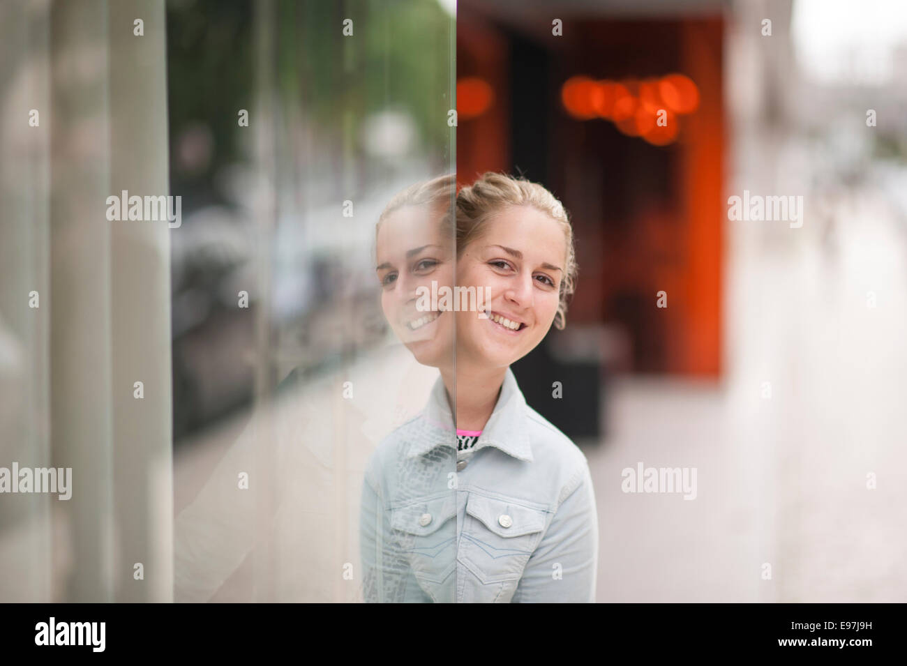 Woman smiling reflection Stock Photo - Alamy