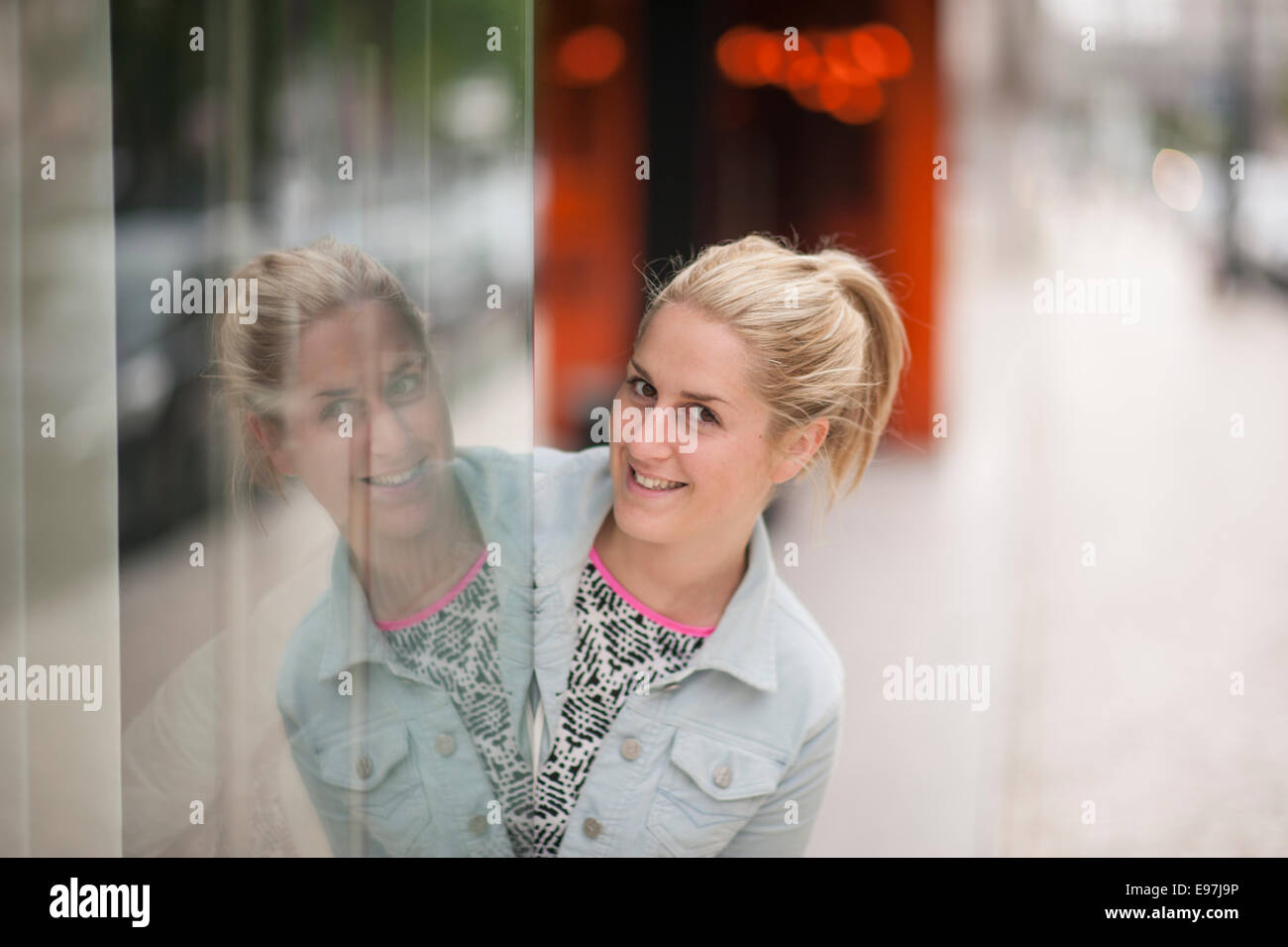 Woman smiling reflection Stock Photo - Alamy