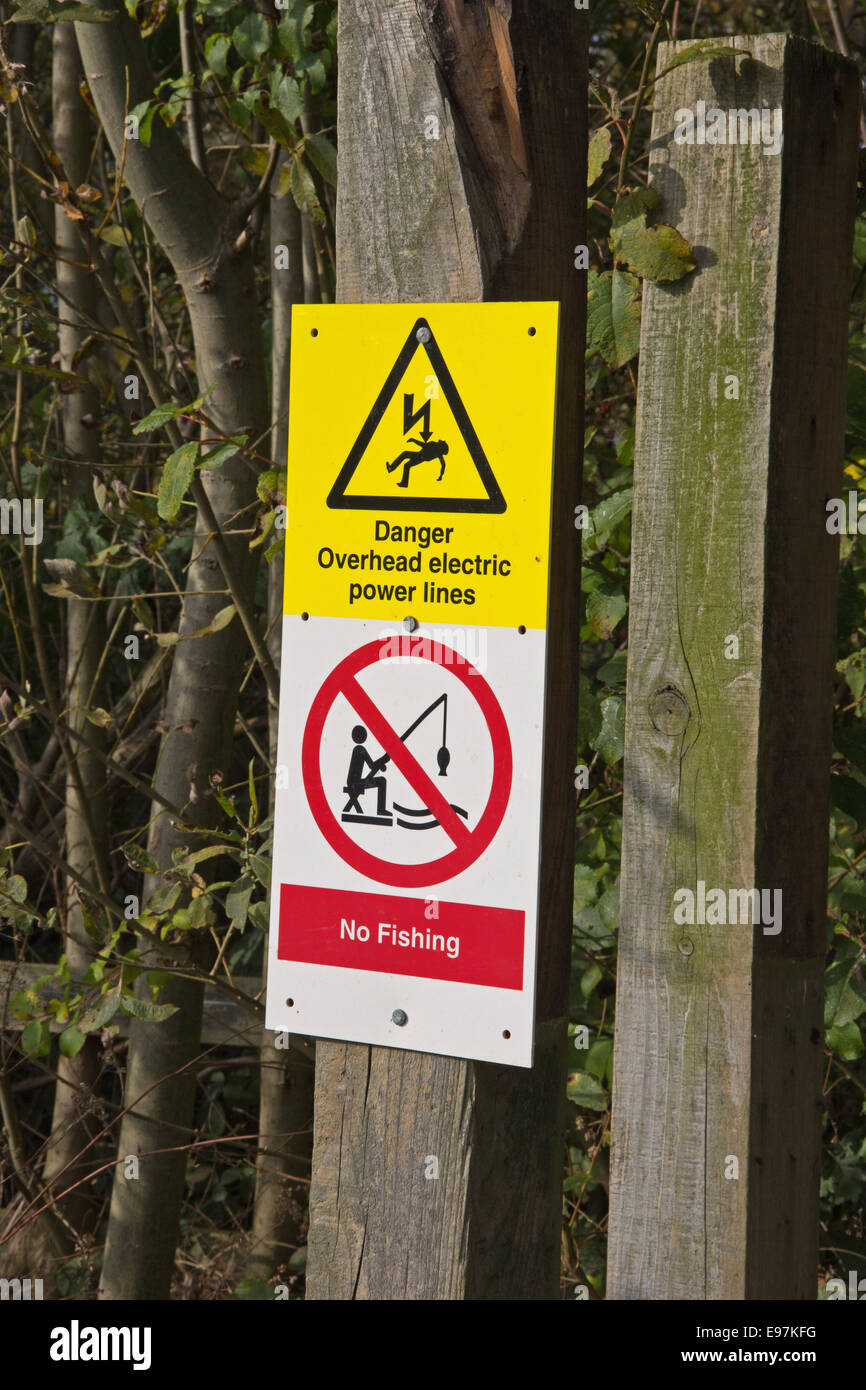 Warning sign for overhead power lines Stock Photo - Alamy