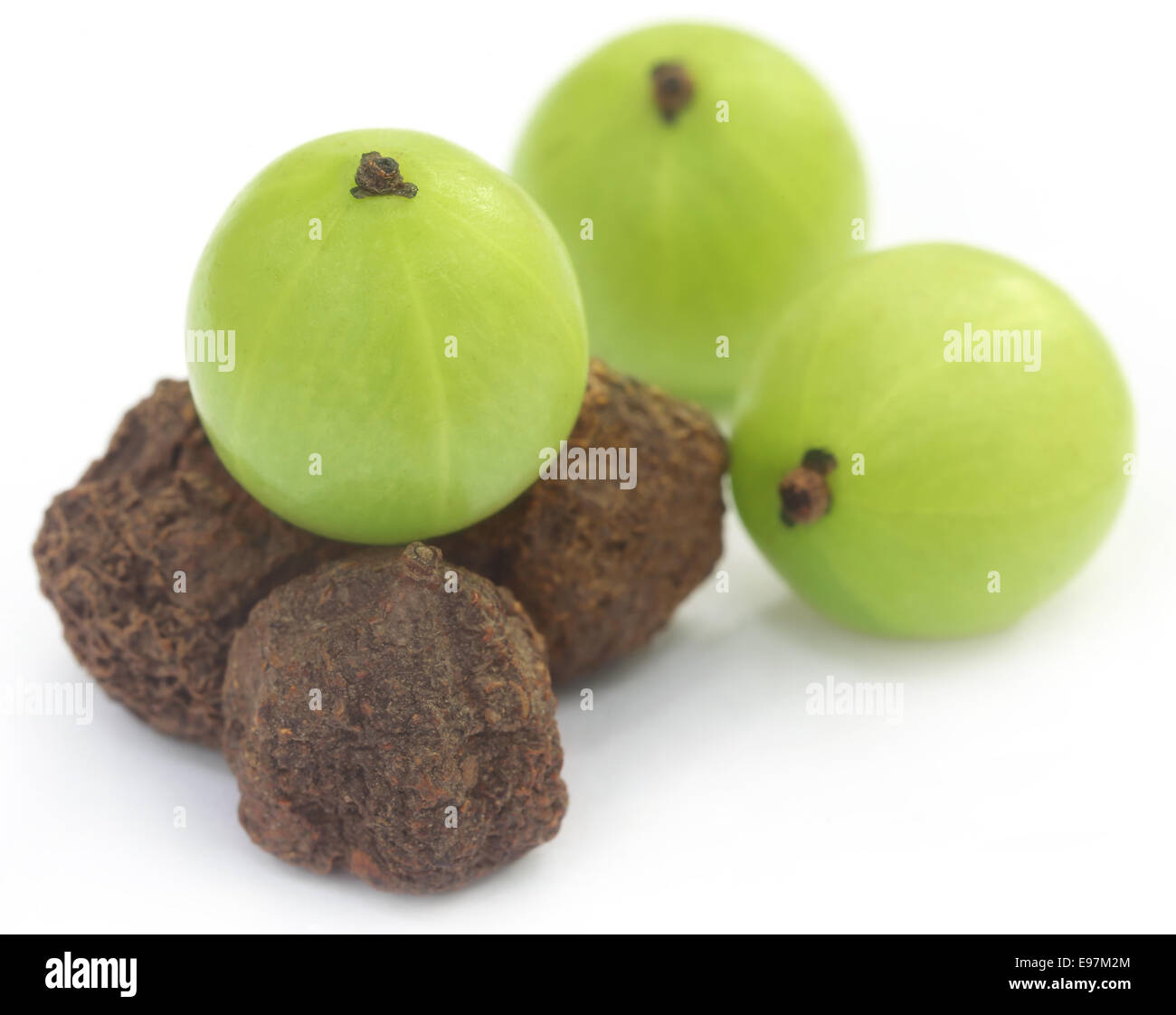 Amla fruits - dried and green over white background Stock Photo - Alamy