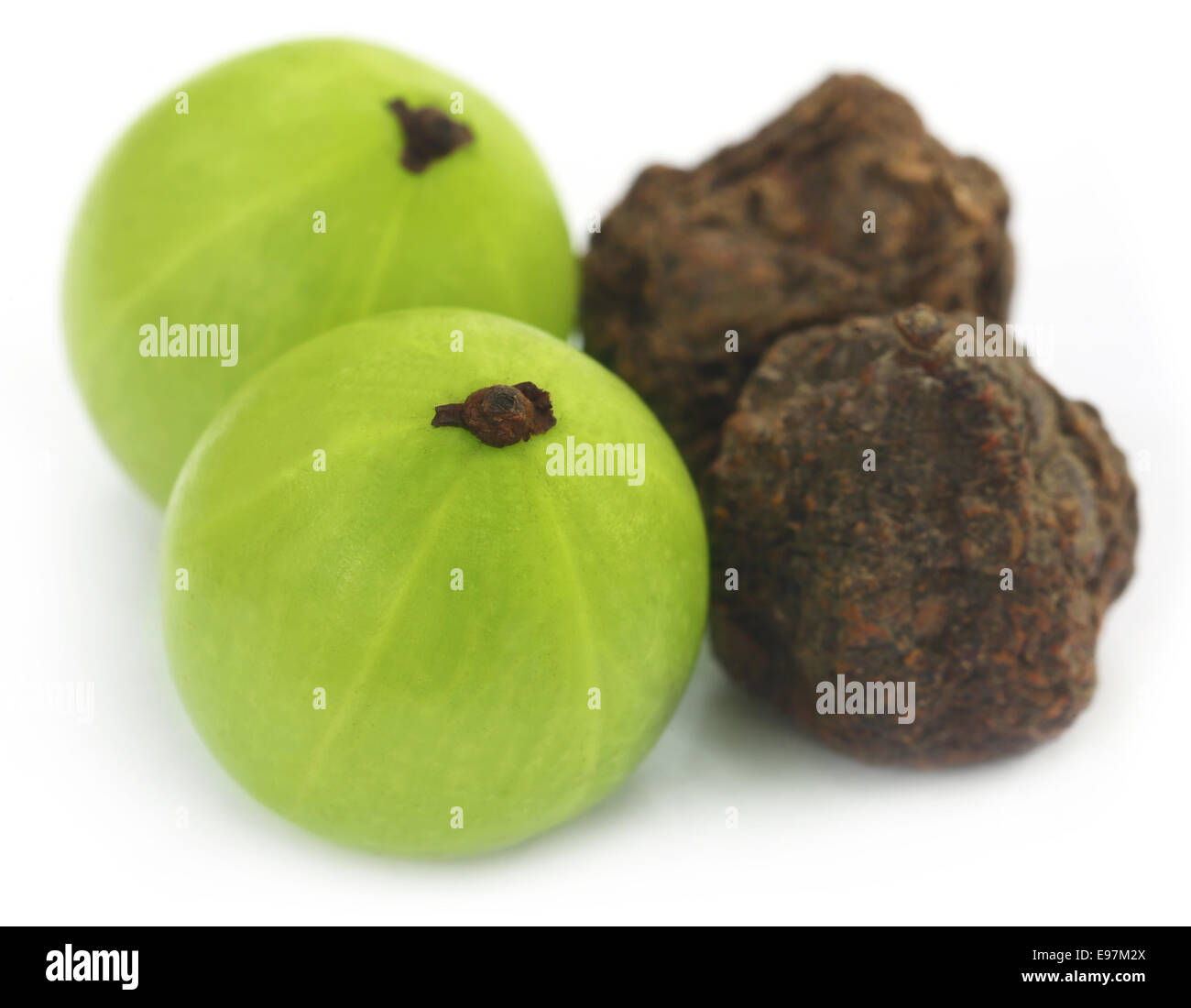 Amla fruits - dried and green over white background Stock Photo - Alamy