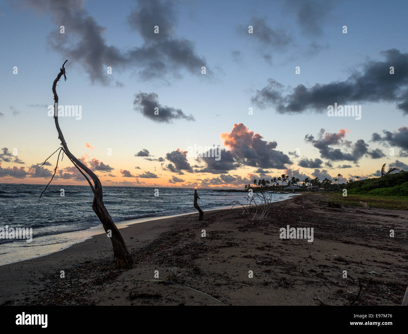 Landscape - Sun rising behind a cloud formation in the background with ...