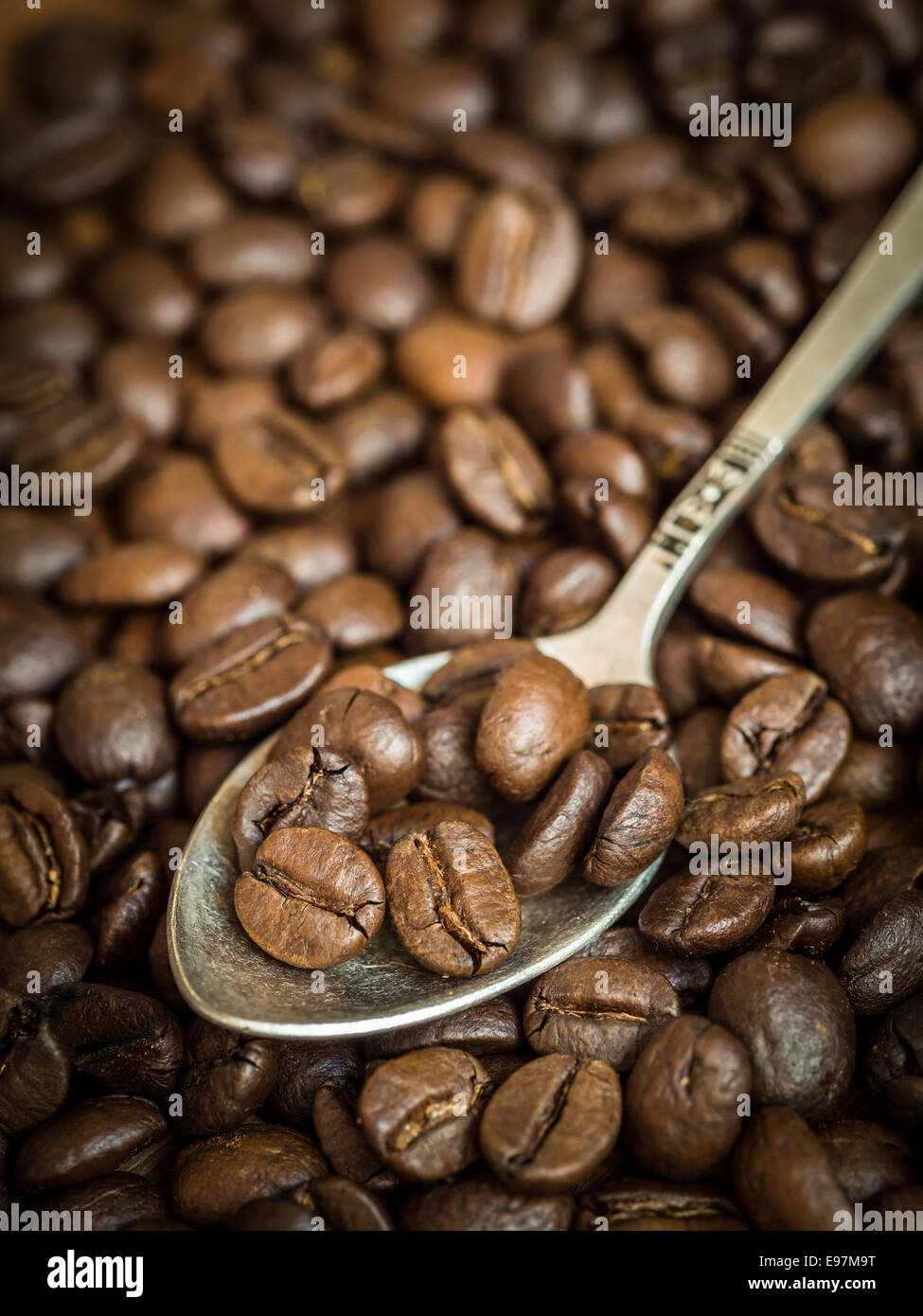Coffee beans on a spoon Stock Photo - Alamy