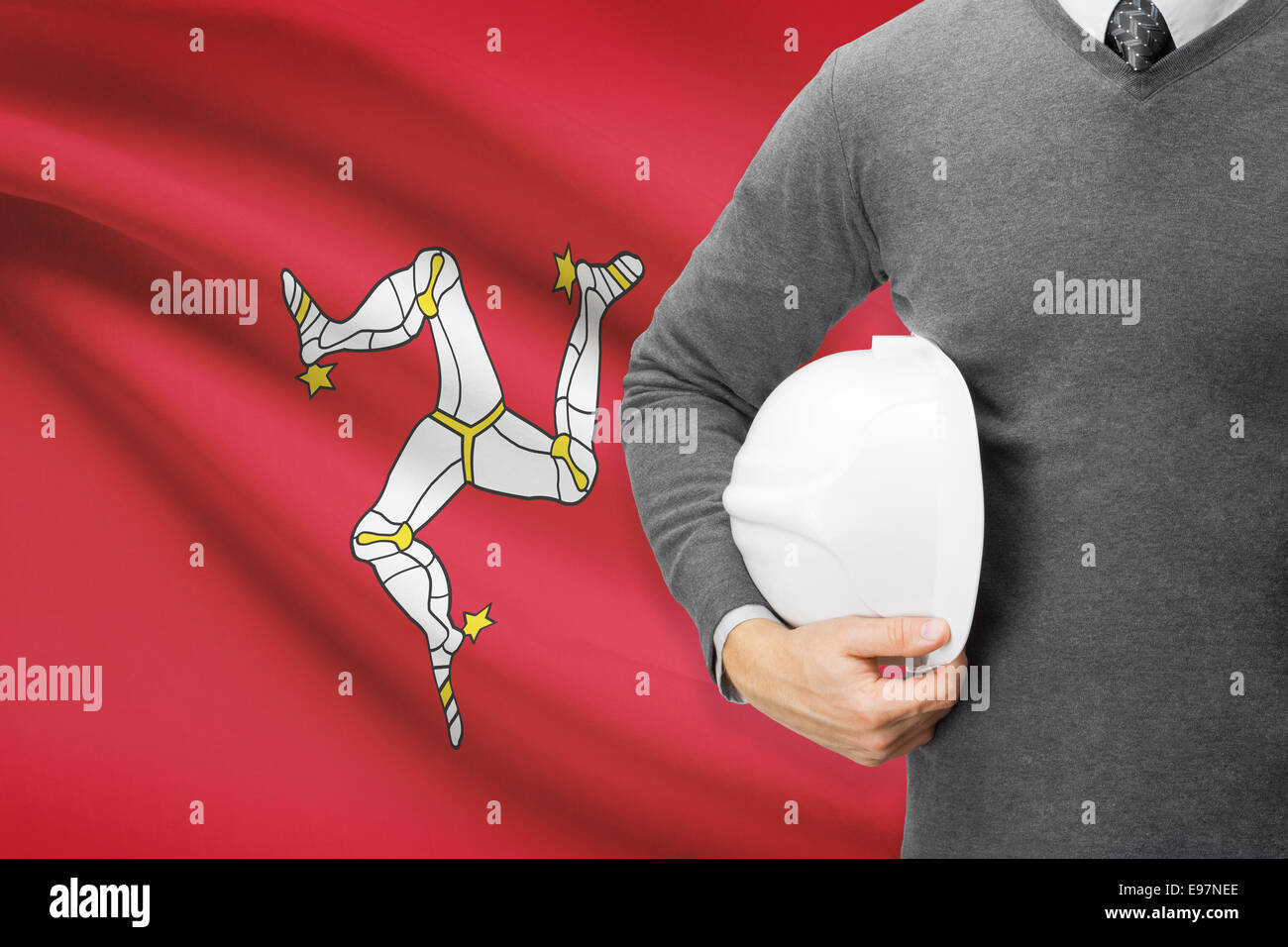 Engineer with flag on background - Isle of Man Stock Photo - Alamy