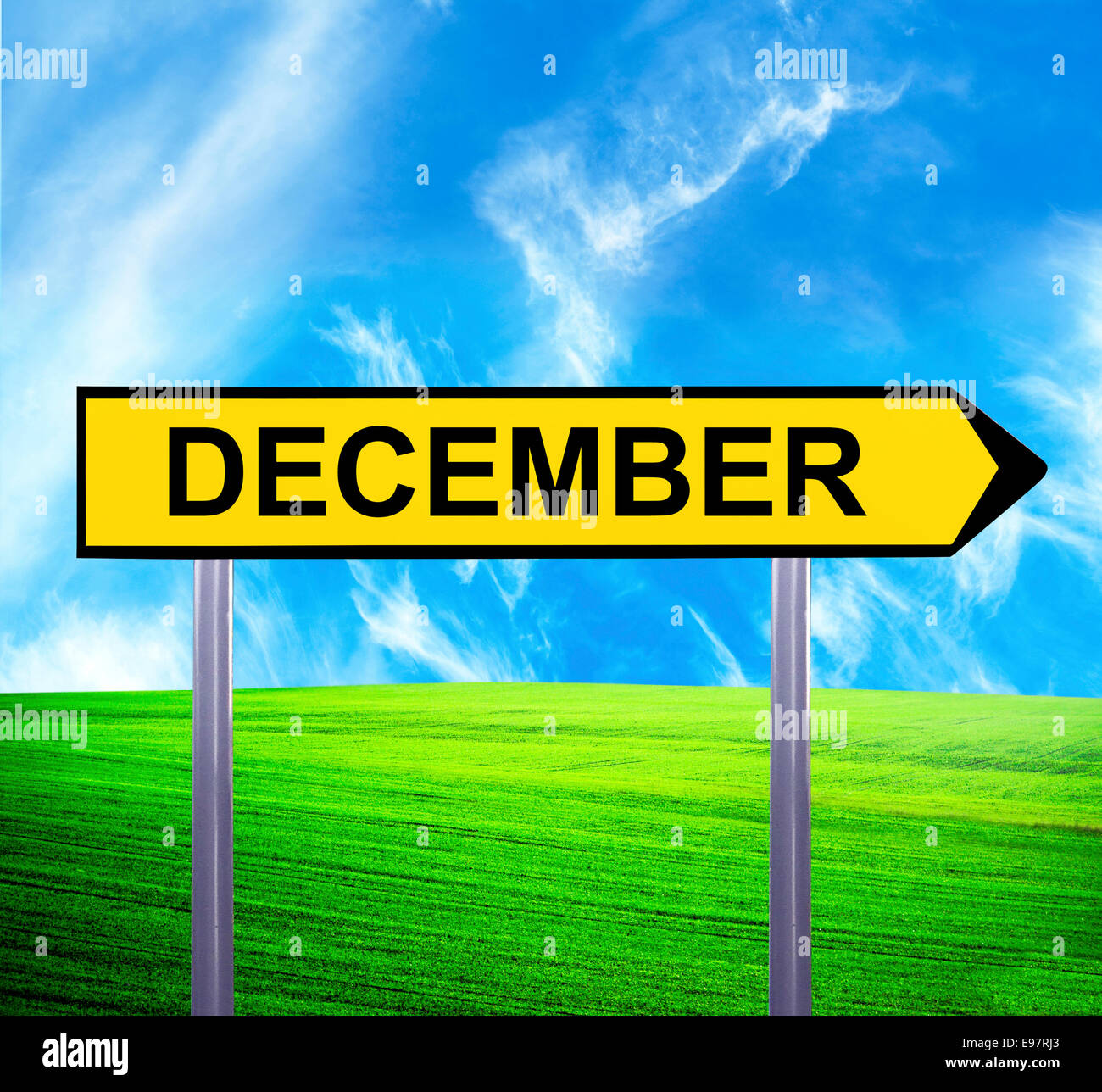 Conceptual arrow sign against beautiful landscape with text - DECEMBER ...