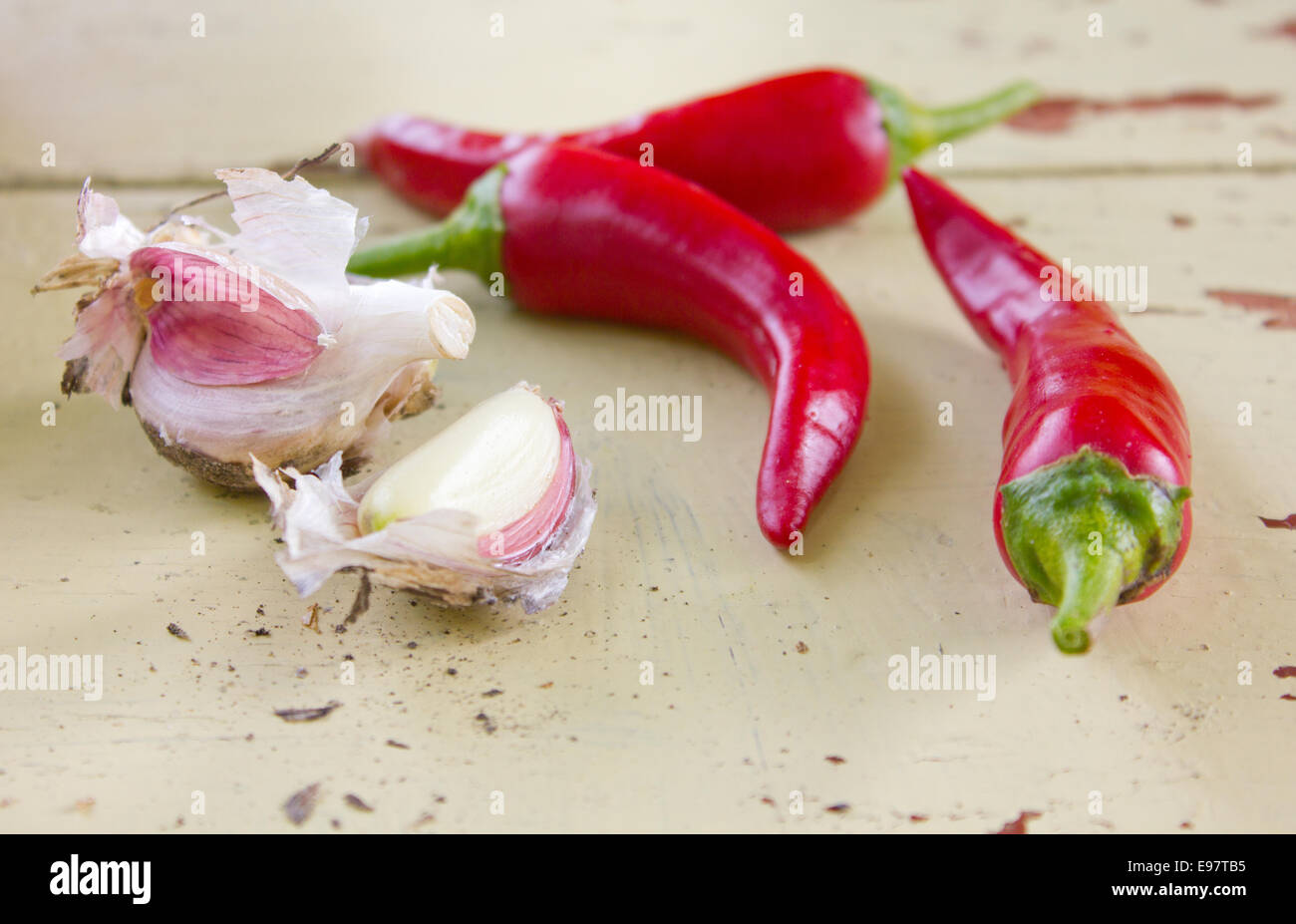 Garlic and red pepper on a table Stock Photo - Alamy