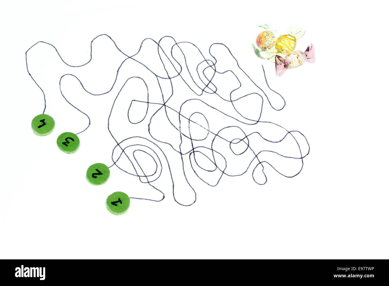 Labyrinth game candy with four routes Stock Photo - Alamy