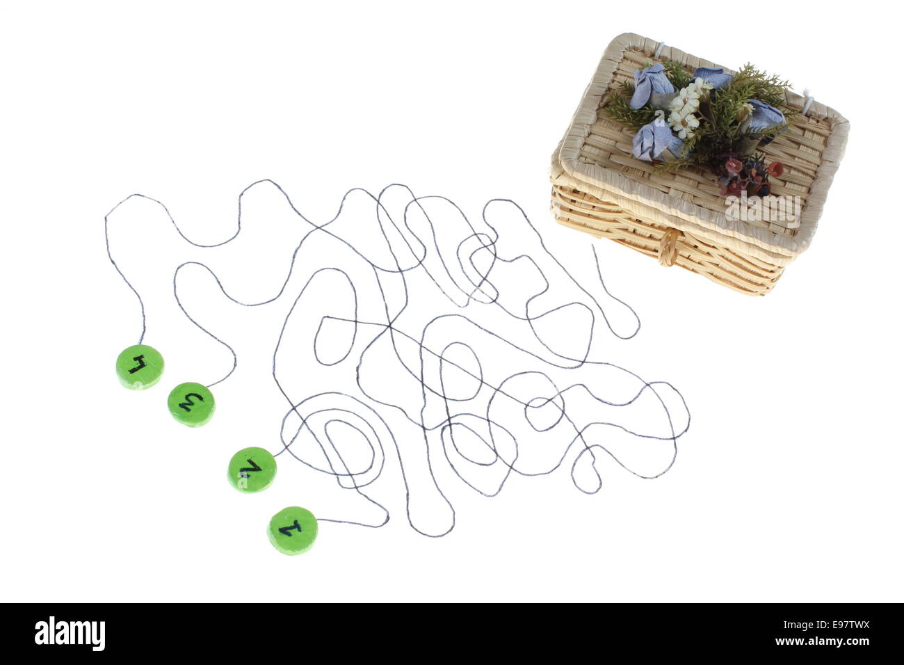 Labyrinth game basket with four routes Stock Photo - Alamy