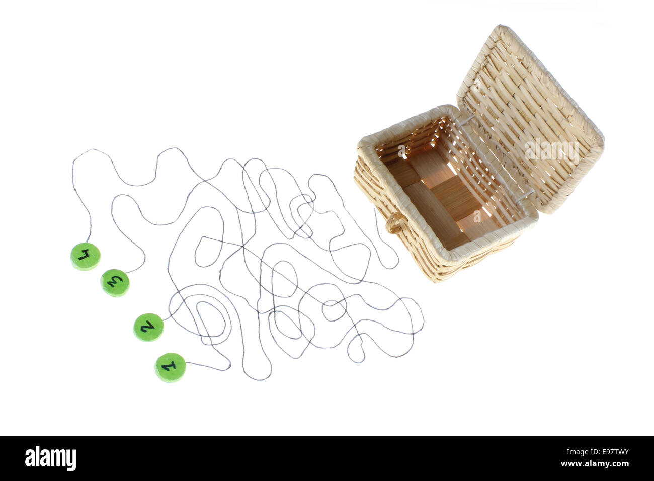 Labyrinth game basket with four routes Stock Photo - Alamy