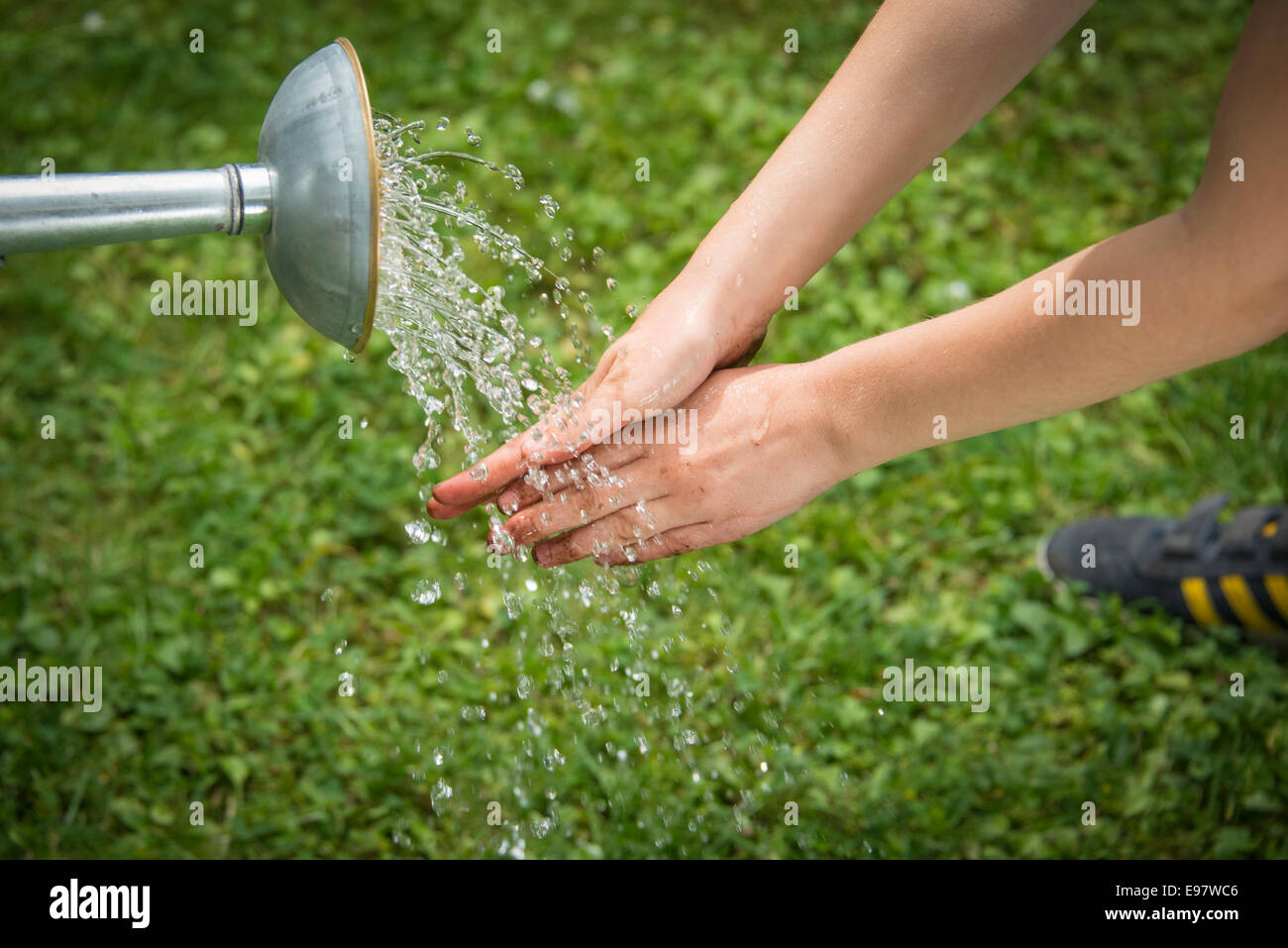 Girl gardening, washing hands, close-up Stock Photo - Alamy
