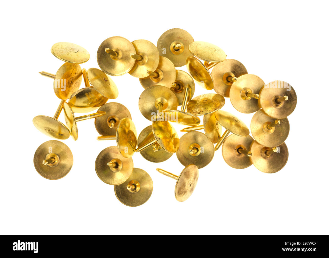 A small group of gold thumbnail tacks on a white background Stock Photo ...