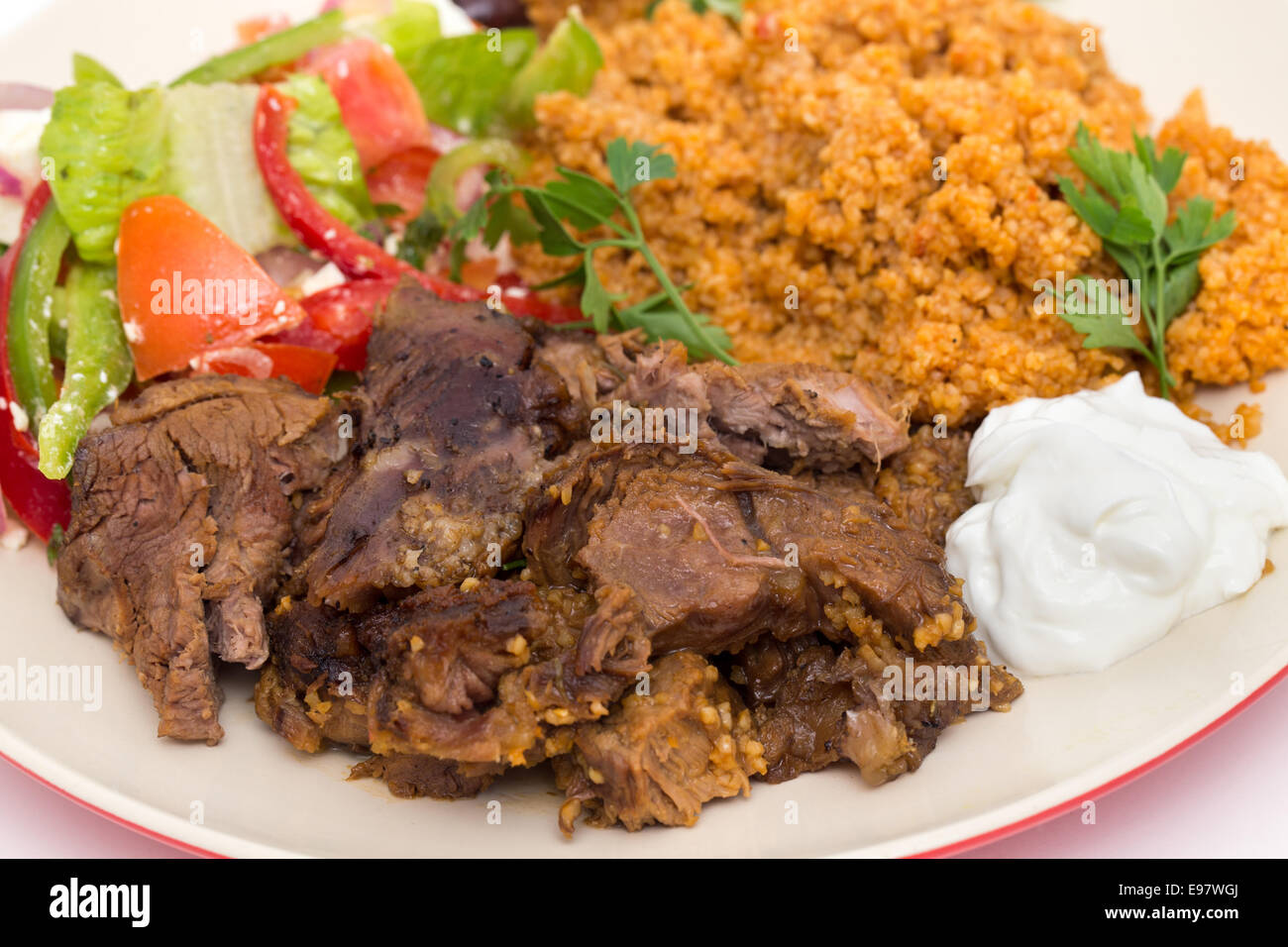 roast lamb kuzu tandir, served with bulgur pilaf and a tossed Turkish ...