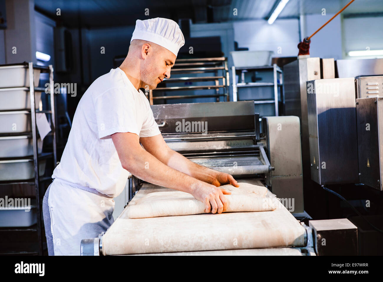 Confectioner kneading pastry dough in bakery Stock Photo - Alamy